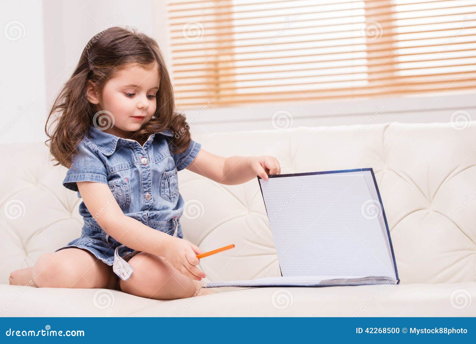 Charming Little Girl Opening Notebook. Stock Photo - Image of enjoyment ...