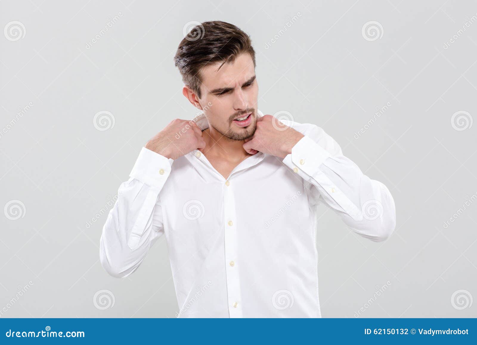 Charming Man Adjusting His Shirt Stock Photo - Image of white ...