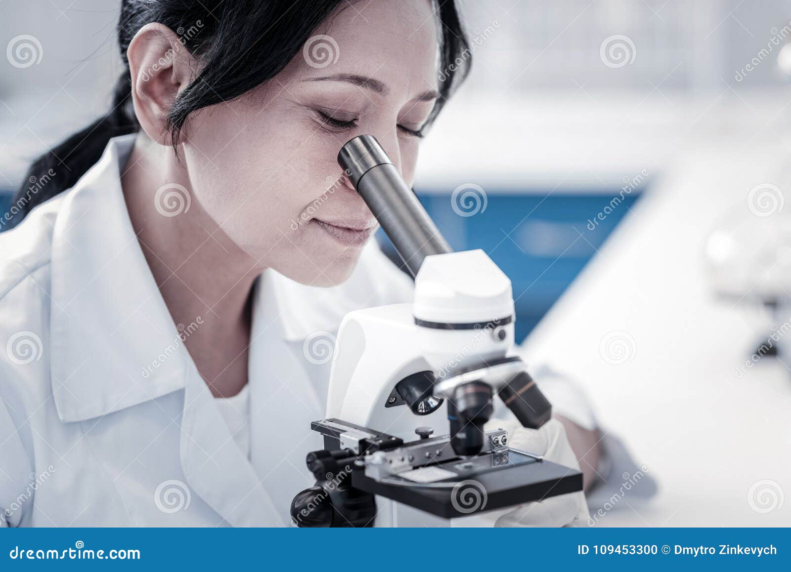 Charming Mature Lady Examining Sample Under Microscope Stock Photo ...