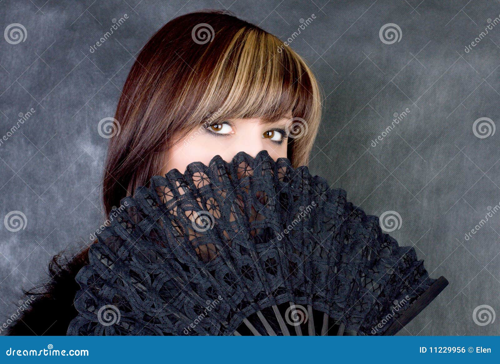 Charming woman with fan stock photo. Image of studio - 11229956