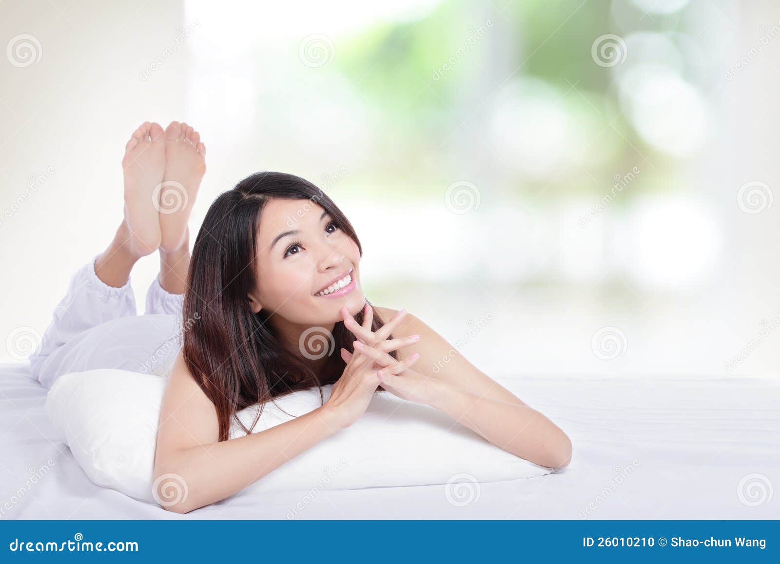 Charming Woman Lying on Bed and Looking Copy Space Stock Photo - Image ...