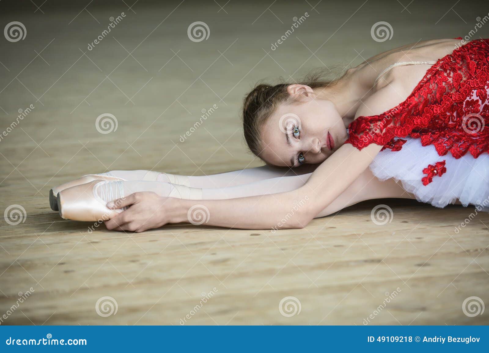 Charming Young Dancer Doing Stretching Leaned Over, Looking at T Stock ...