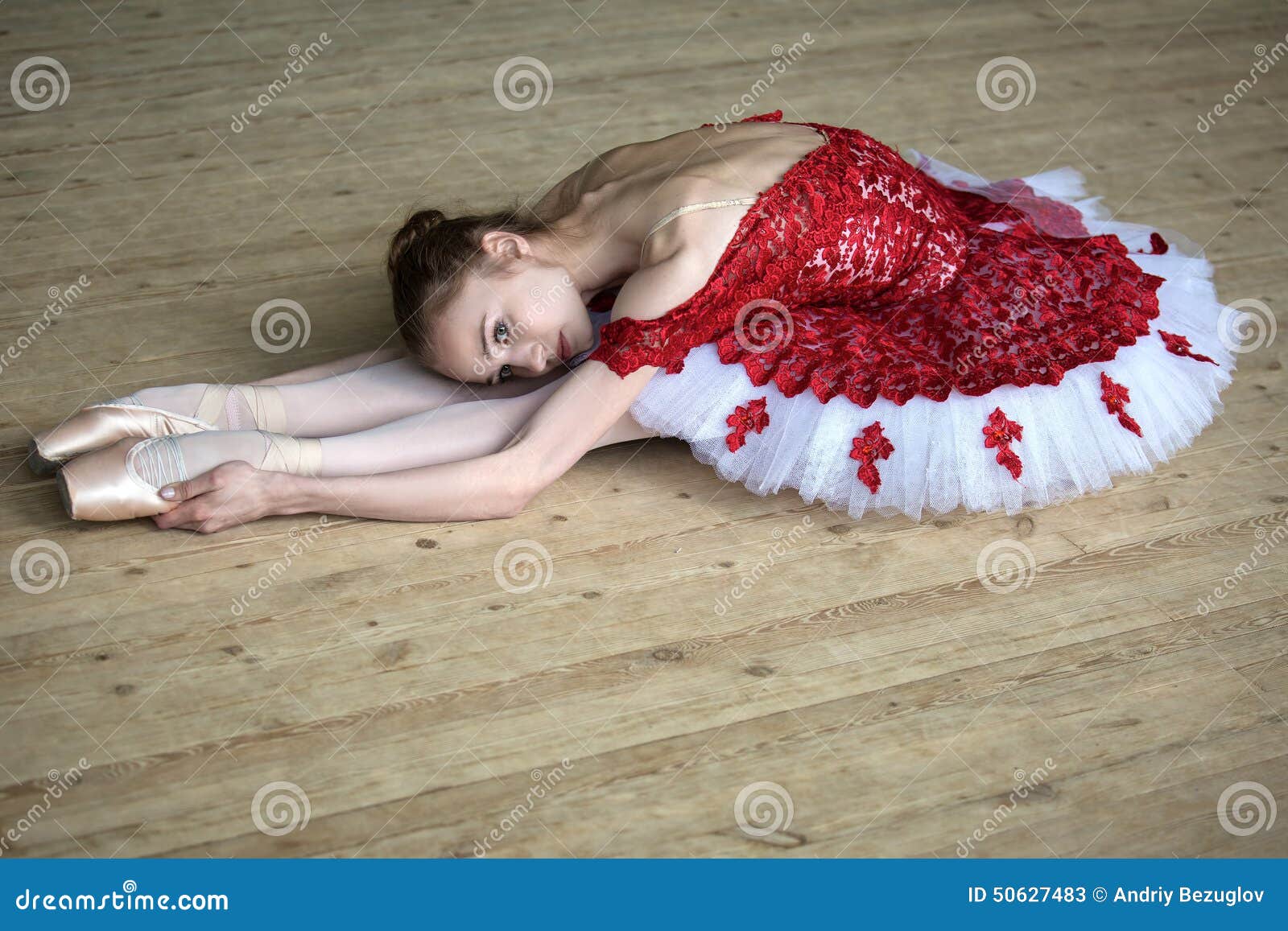 Charming Young Dancer Doing Stretching Leaned Over, Looking at T Stock ...