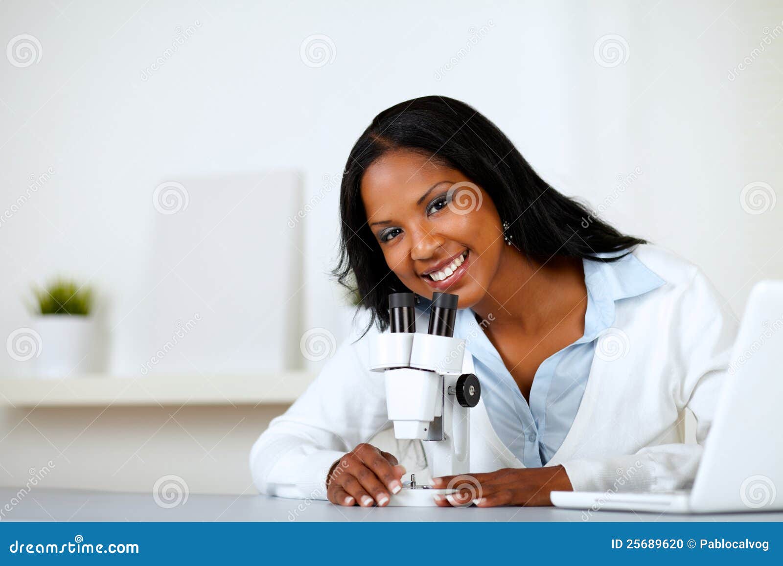 Charming Young Female Using a Microscope Stock Photo - Image of ...
