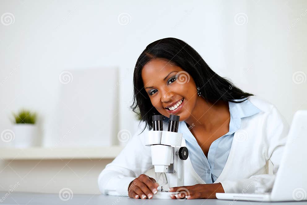 Charming Young Female Using a Microscope Stock Photo - Image of ...