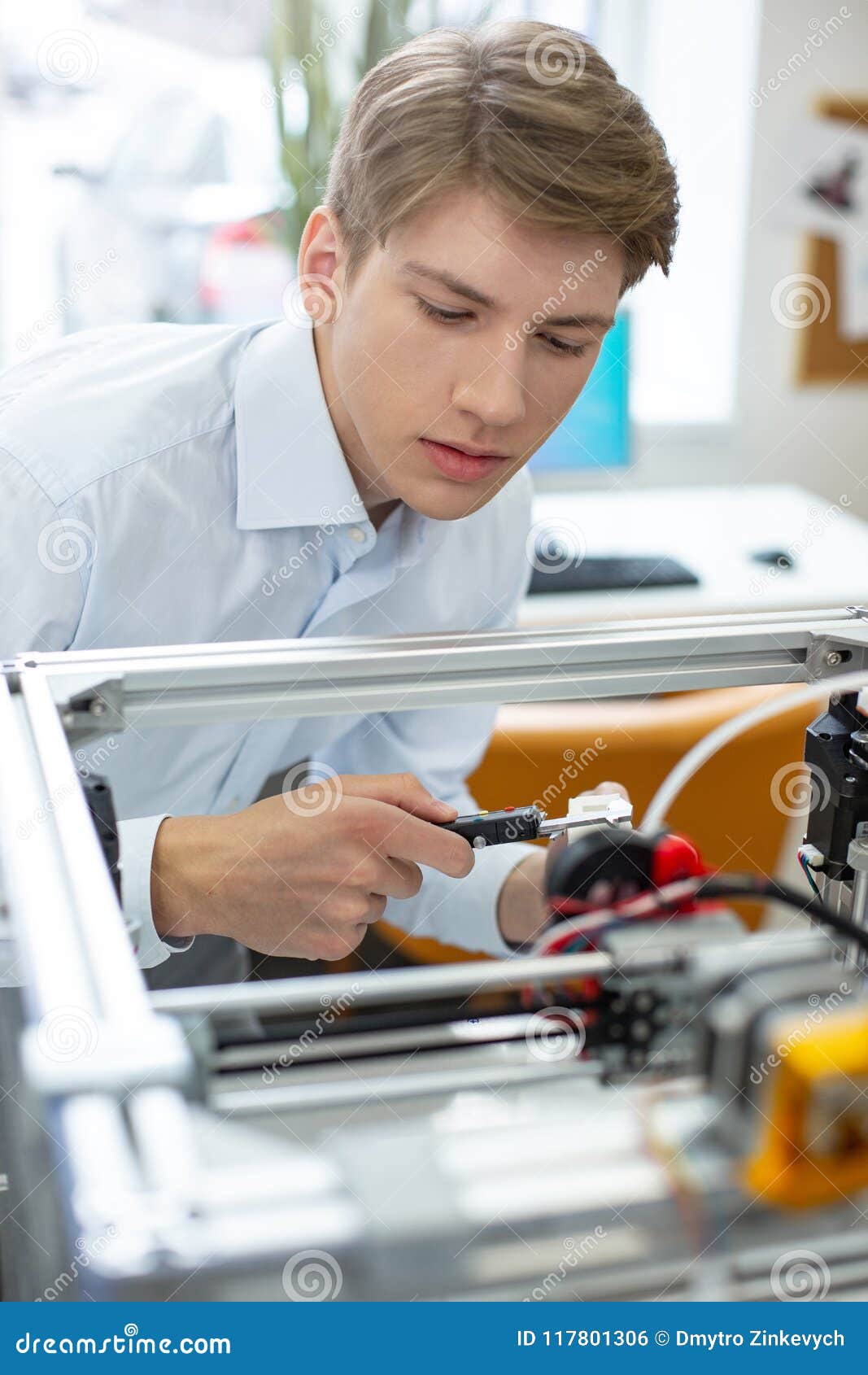Charming Young Man Using Digital Caliper To Measure Printed Model Stock ...