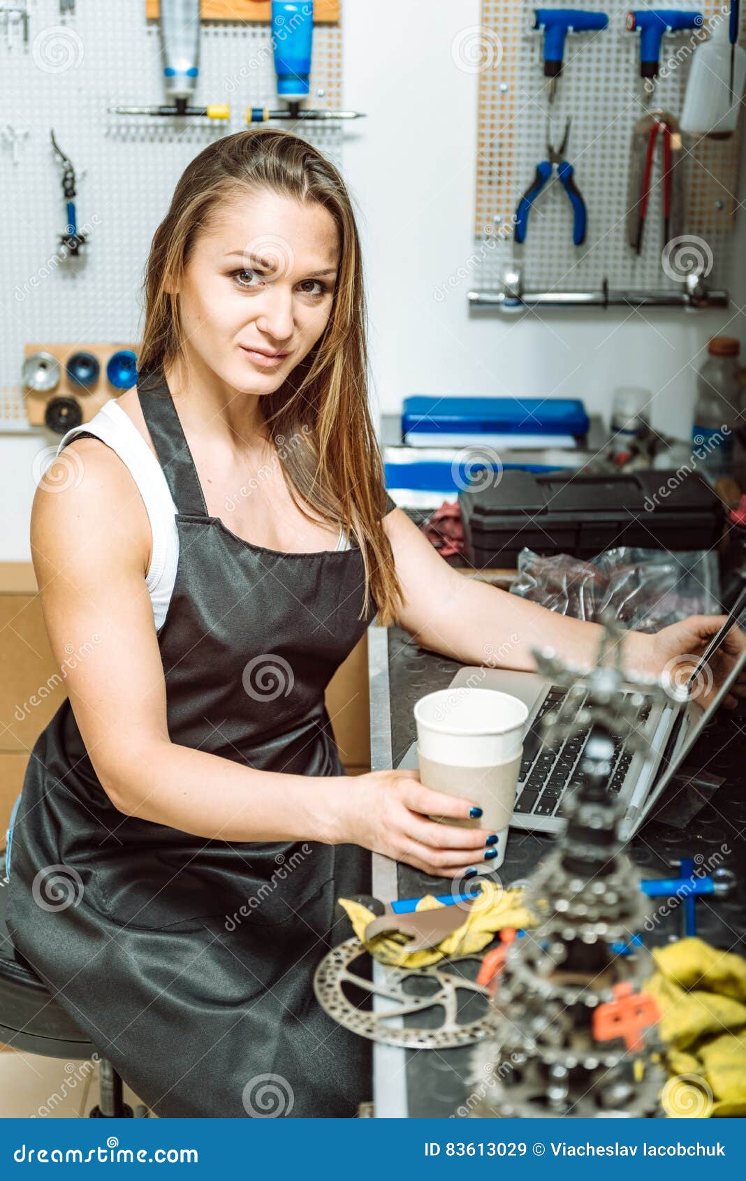 Charming Young Mechanic Using the Laptop in the Workshop Stock Image ...