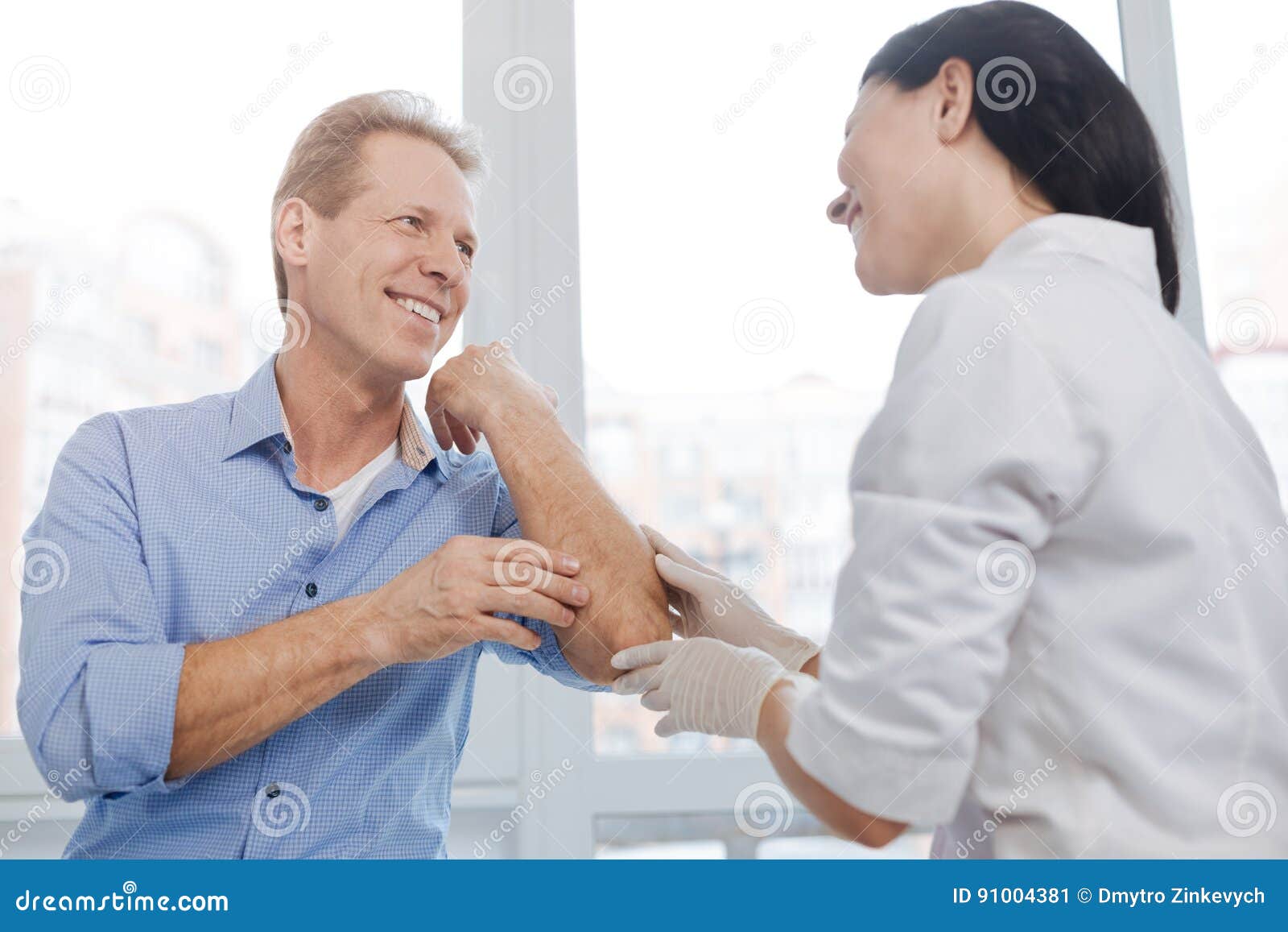 Charming Young Practitioner Examining Patient Problems at Work Stock ...