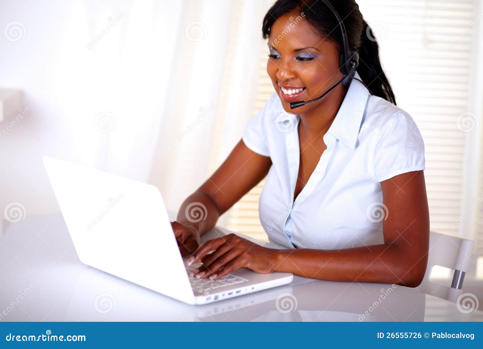 Charming Young Receptionist Working on Laptop Stock Photo - Image of ...