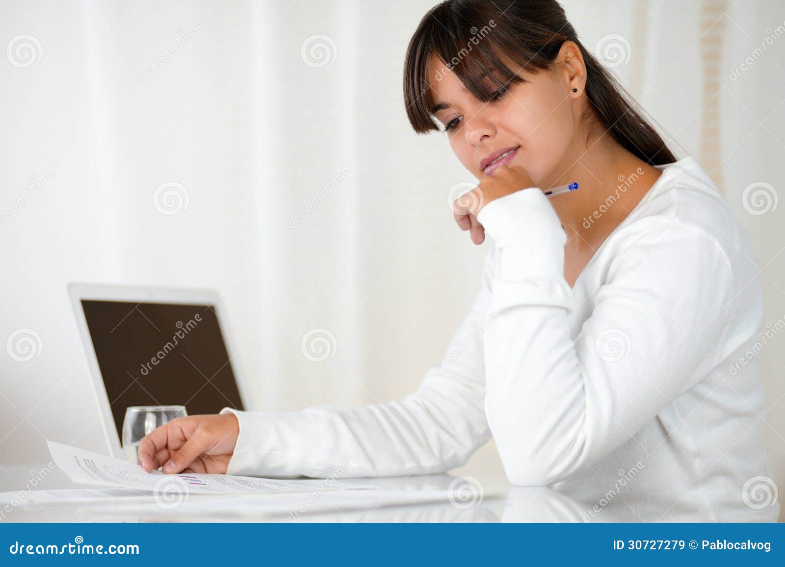 Charming Young Woman Reading Documents at Office Stock Image - Image of ...