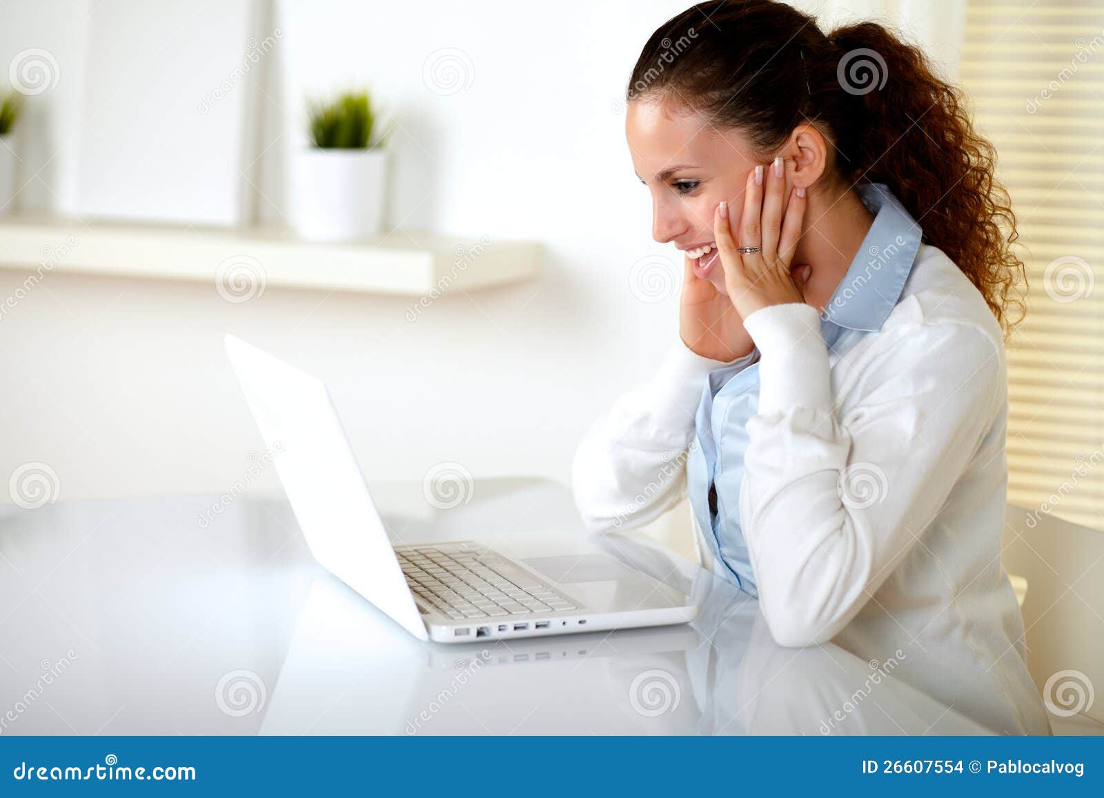 Charming Young Woman Reading on Laptop Screen Stock Photo - Image of ...