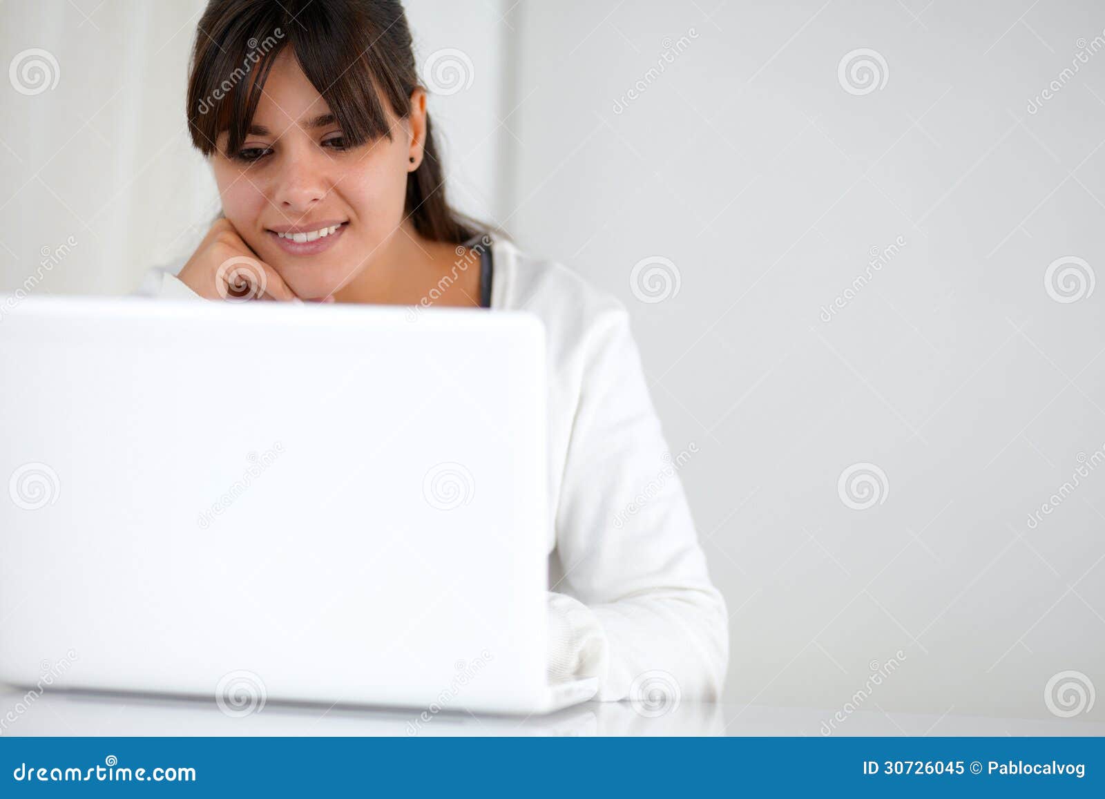 Charming Young Woman Reading on Laptop Screen Stock Image - Image of ...
