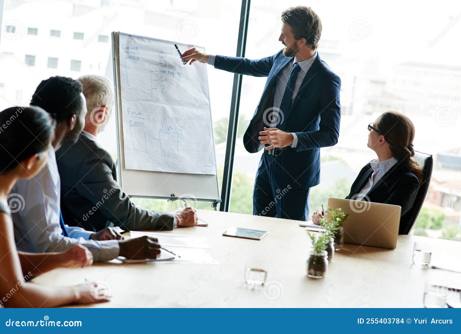 Charting the Steps To Success. a Group of Executives Having a Meeting ...