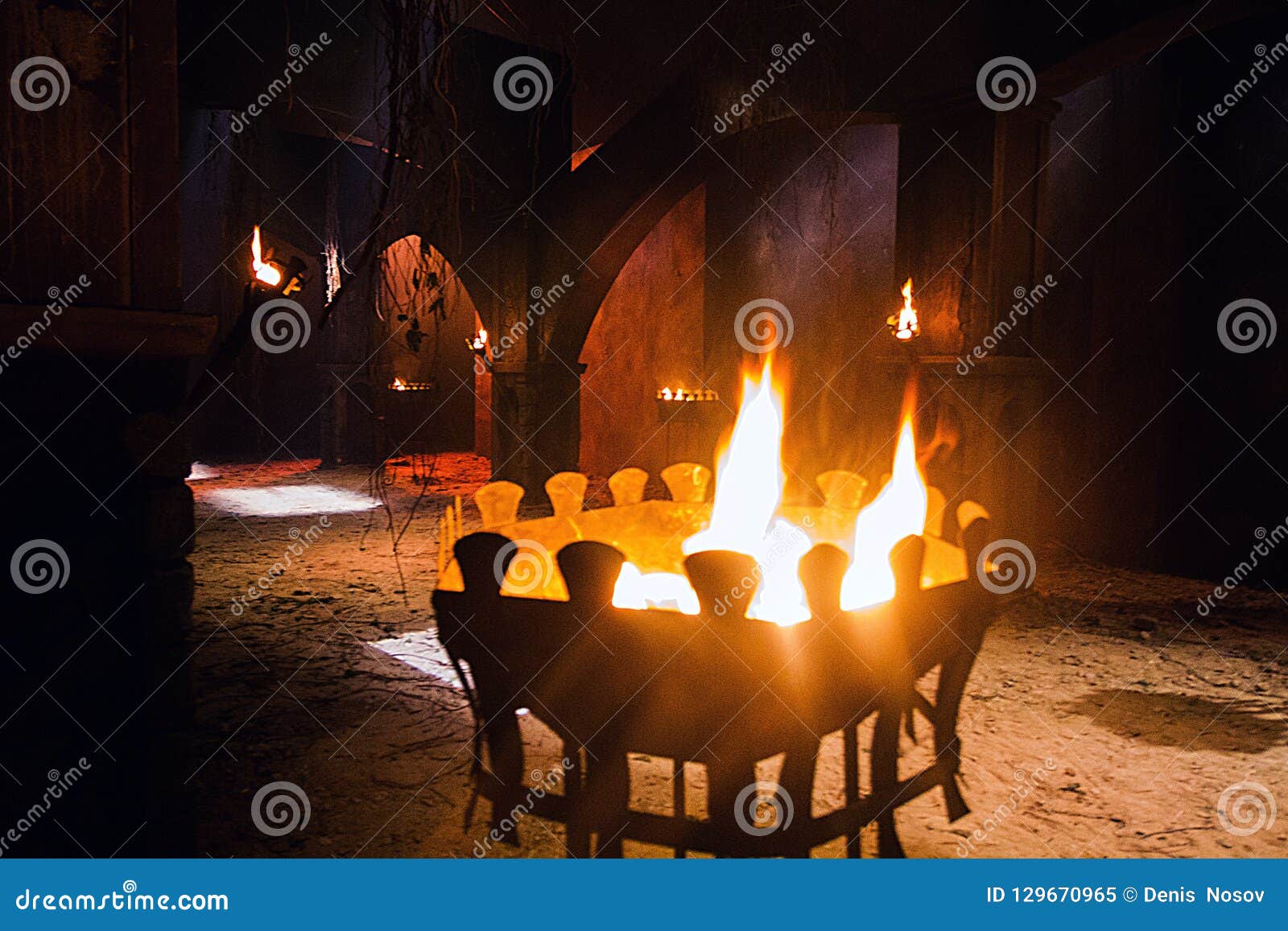 Bonfire in the old castle stock image. Image of yellow - 129670965
