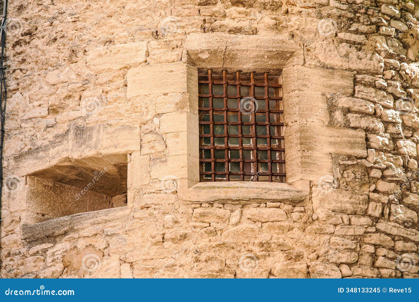 French Chateau with Limestone Exterior and a Barred Window Stock Image ...