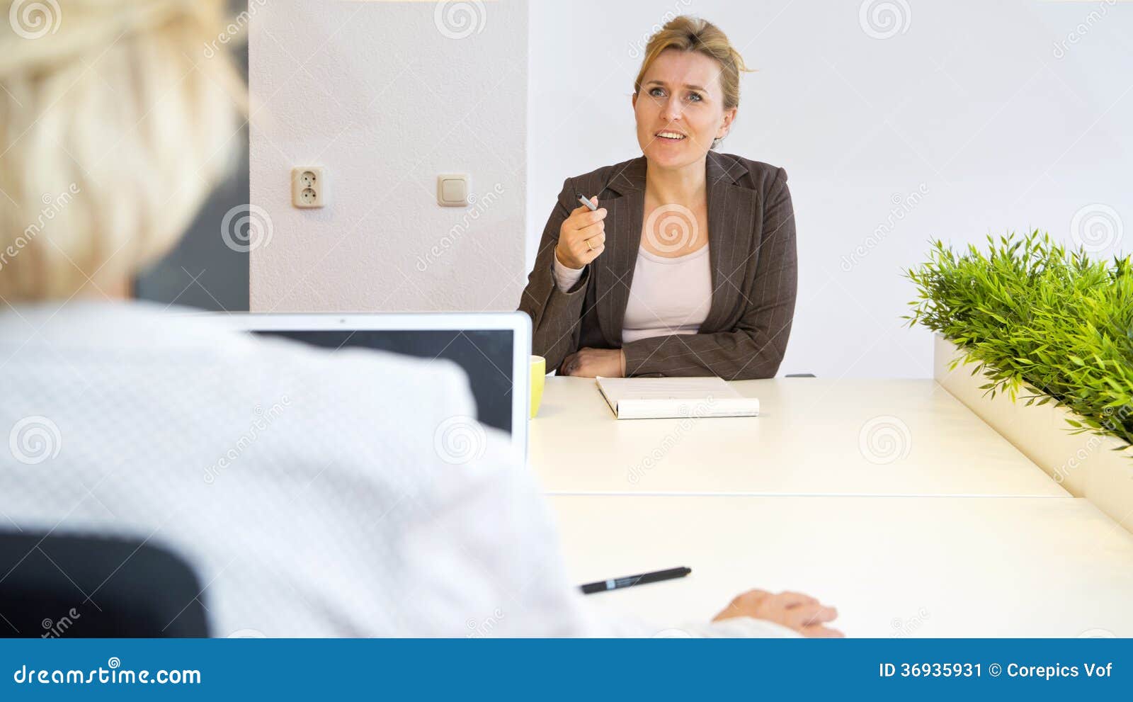 Chatting coworkers stock image. Image of notepad, pointing - 36935931