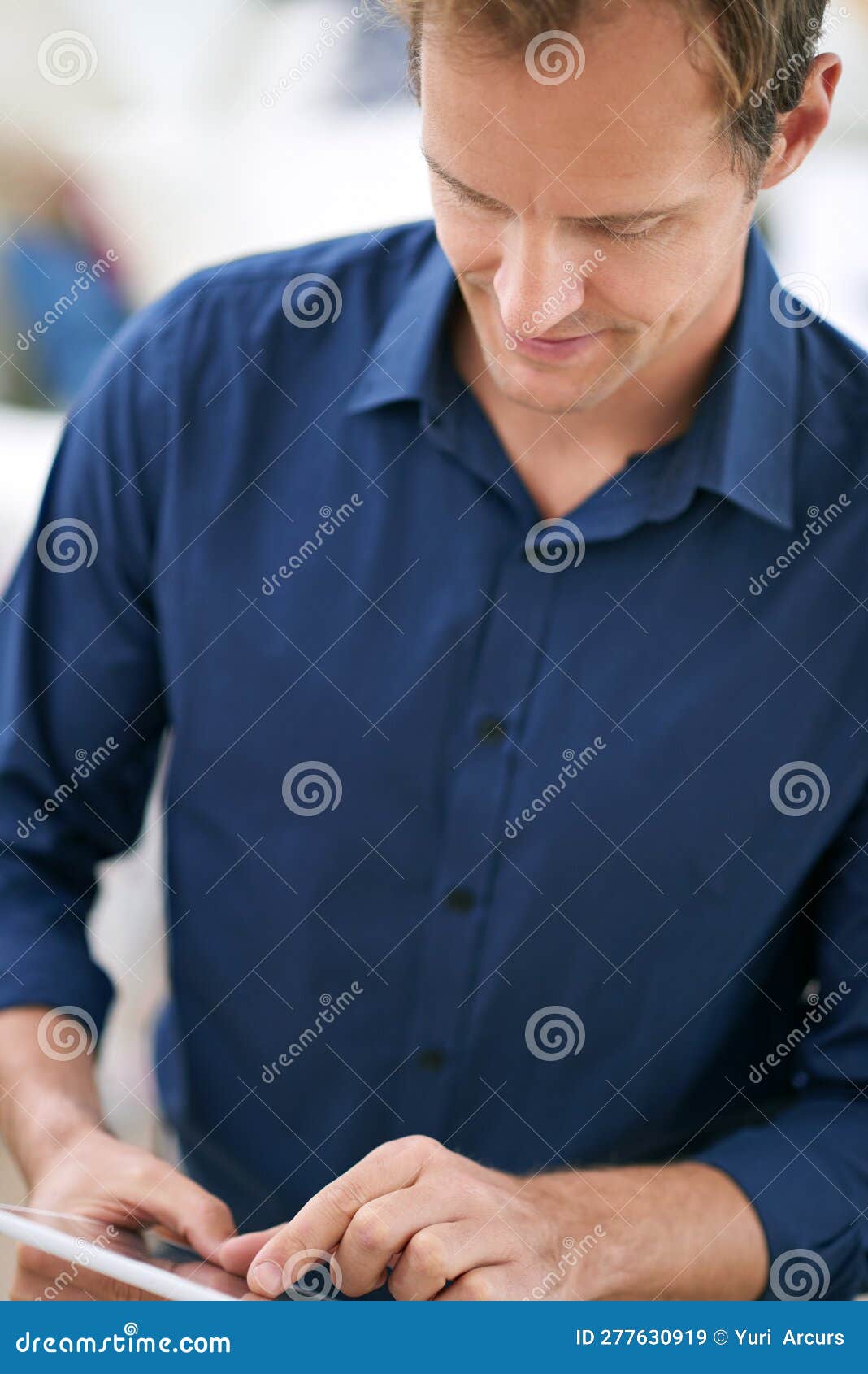 Chatting with His Mates Online. a Handsome Man Using His Tablet at Home ...