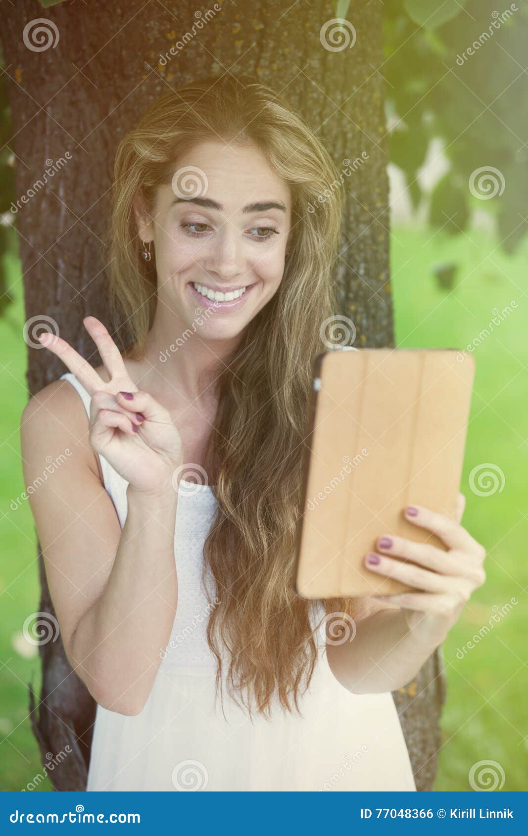 Chatting under the tree stock photo. Image of model, person - 77048366