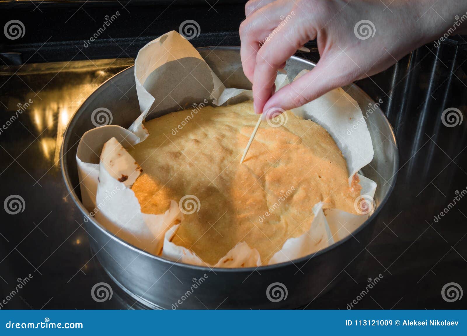 Check a cake for doneness stock image. Image of check - 113121009