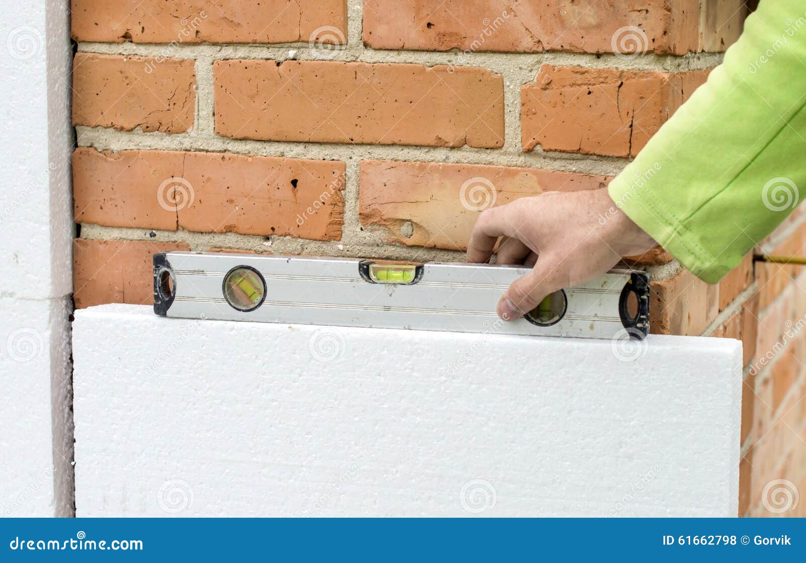 Check Flatness of the Wall Using a Level Stock Photo - Image of facade ...