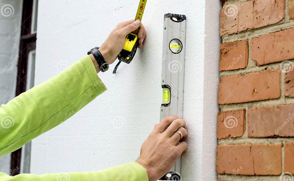 Check Flatness of the Wall Using a Level Stock Photo - Image of walls ...