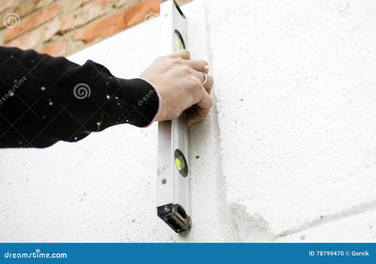 Check Flatness of the Wall Using a Level Stock Photo - Image of ...