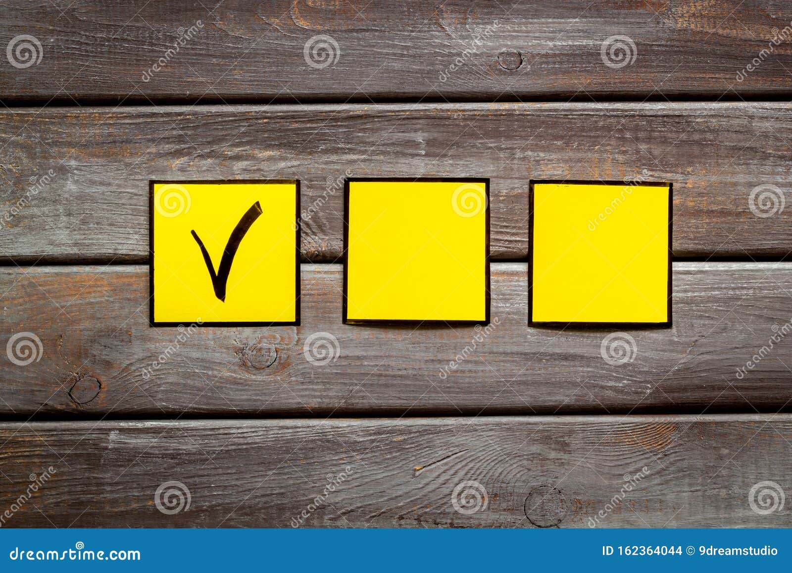 Check Mark in Yellow Check-box on Dark Wooden Background Top View Copy ...