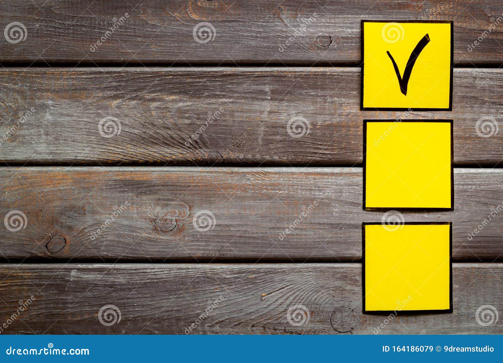 Check Mark in Yellow Check-box on Dark Wooden Background Top View Copy ...