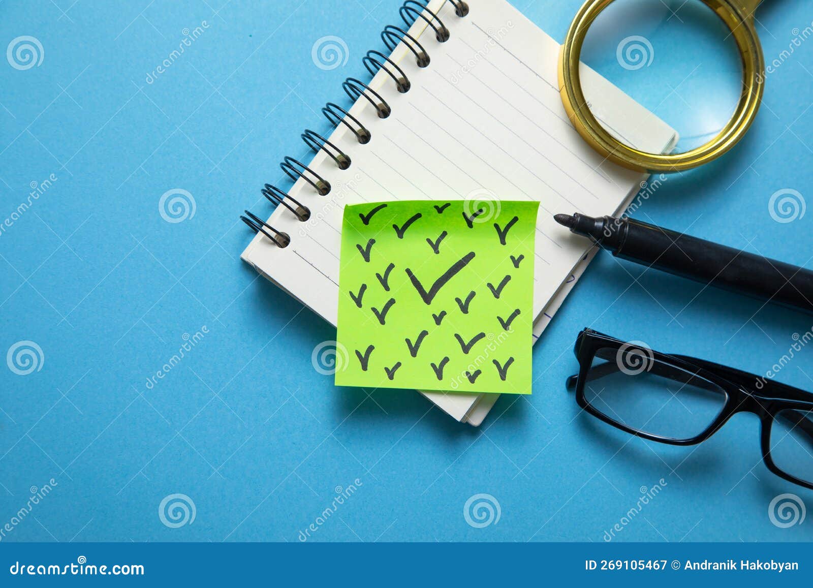 Check Marks on Sticky Note with a Business Objects on the Blue ...