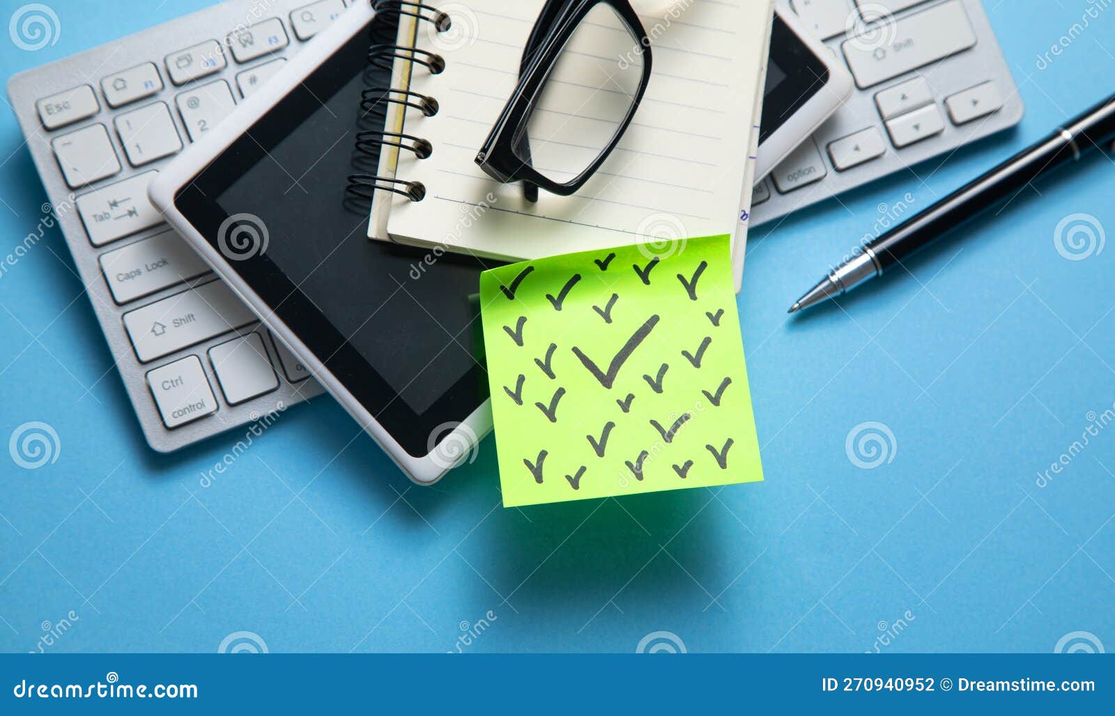 Check Marks on Sticky Note with a Business Objects on the Blue ...
