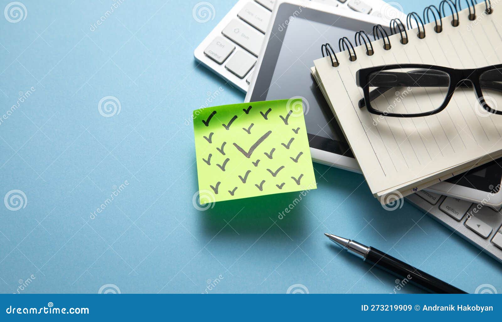 Check Marks on Sticky Note with a Business Objects on the Blue ...