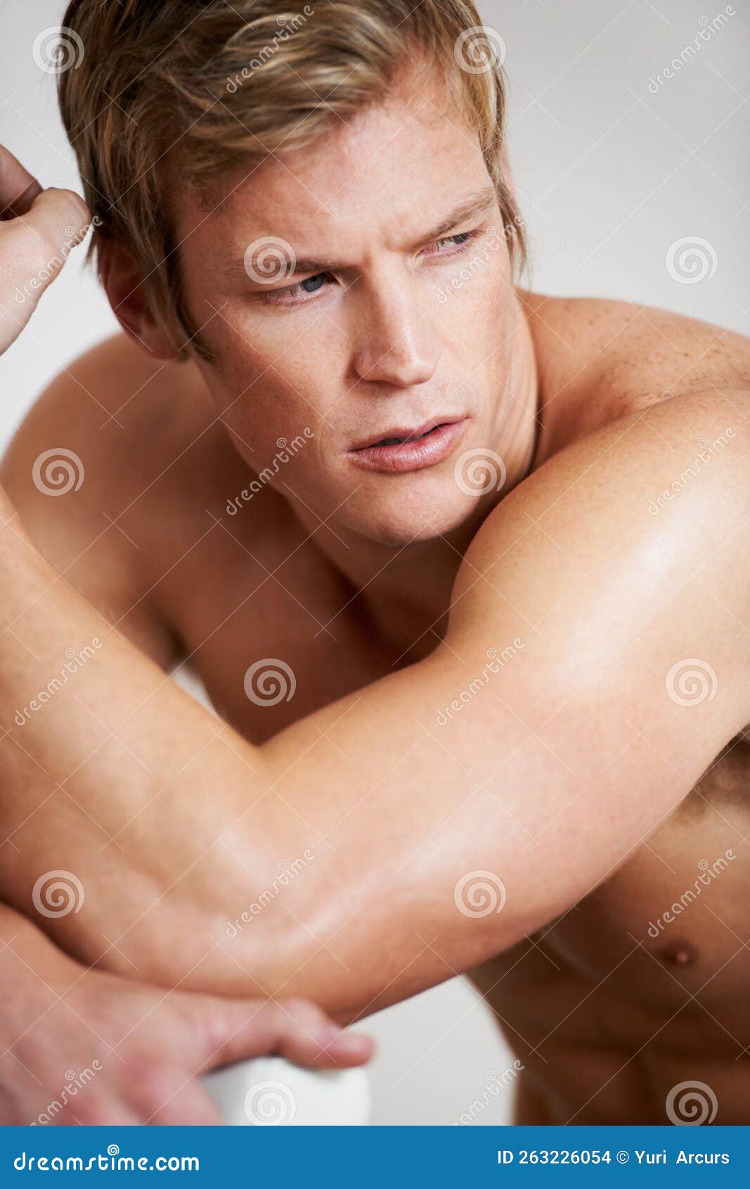 Check Out those Massive Muscles. a Muscular Young Man Posing in Studio ...