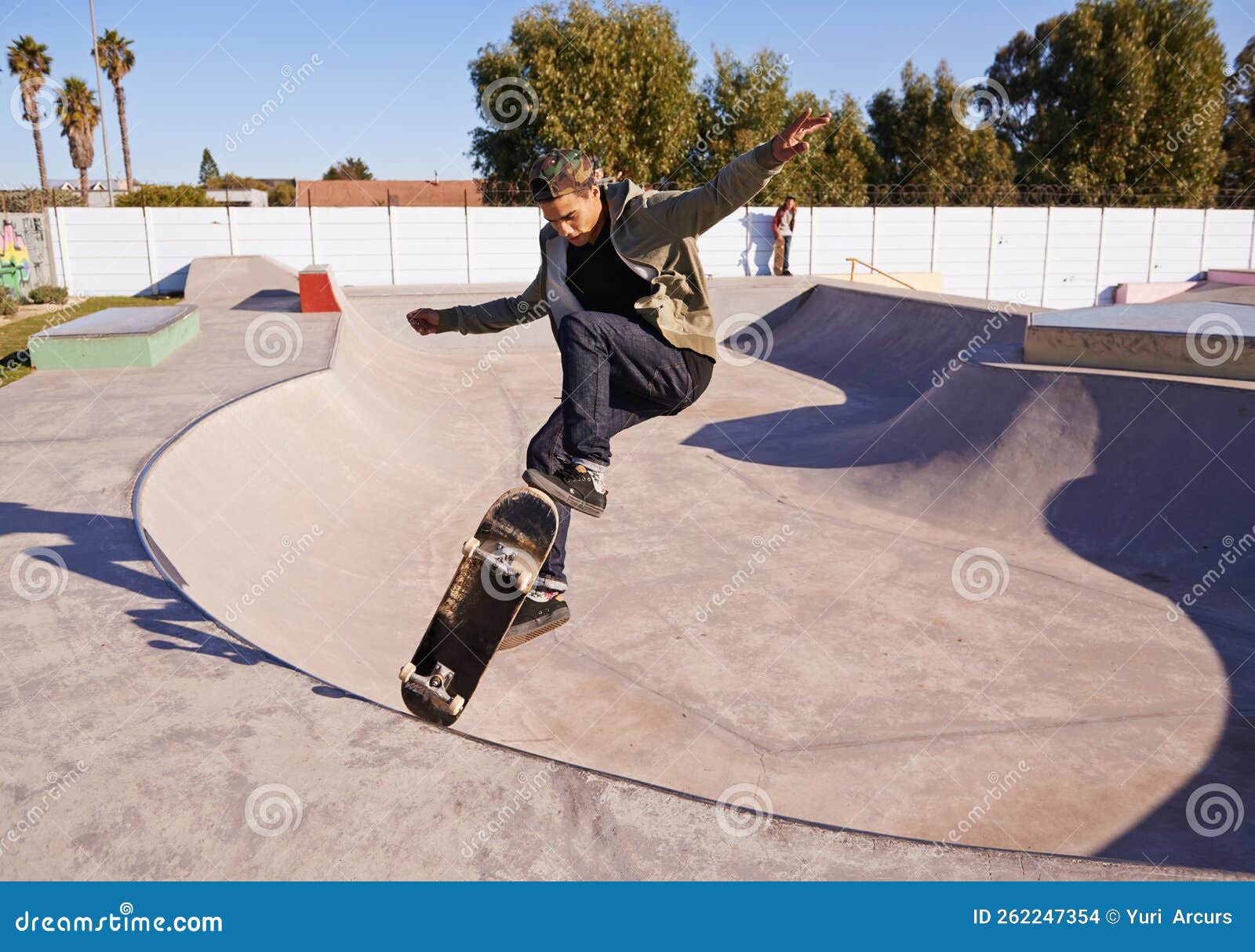 Check this Out. a Young Man Doing Tricks on His Skateboard at the Skate ...