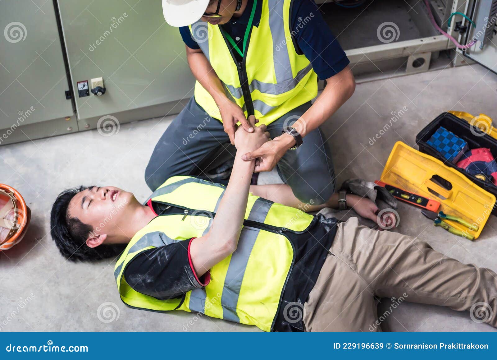 Accident in Industrial Work with First Aid Stock Image - Image of ...