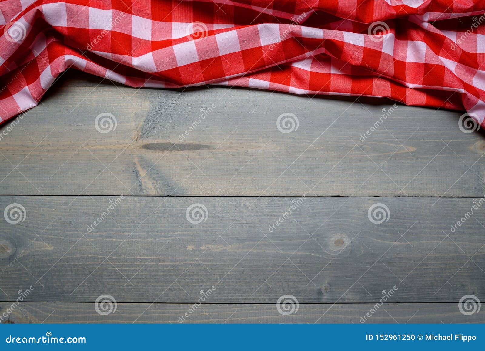 A Checked Gingham Picnic Tablecloth on Old Wooden Table Top View Stock ...