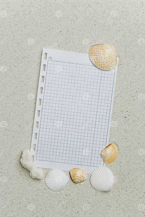 Checked Paper for Notes on Sand Stock Photo - Image of adventure, frame ...