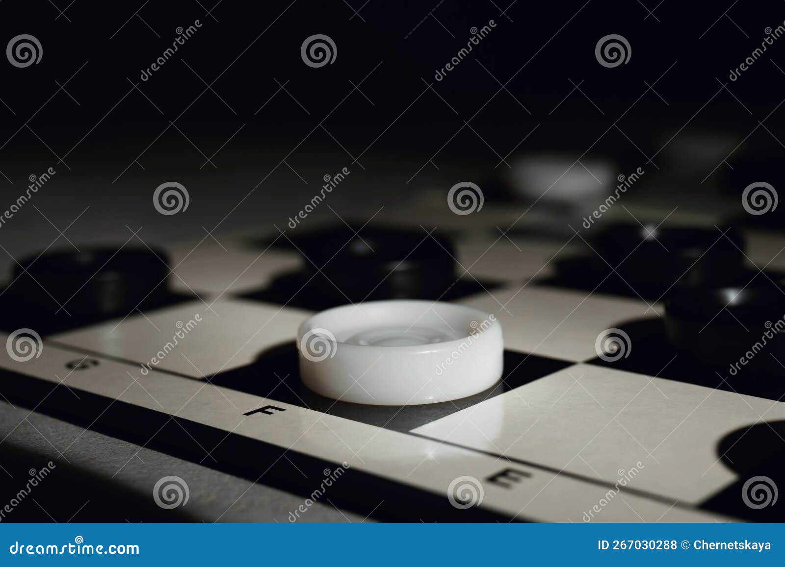 Checkerboard with Game Pieces on Dark Background, Closeup Stock Photo ...