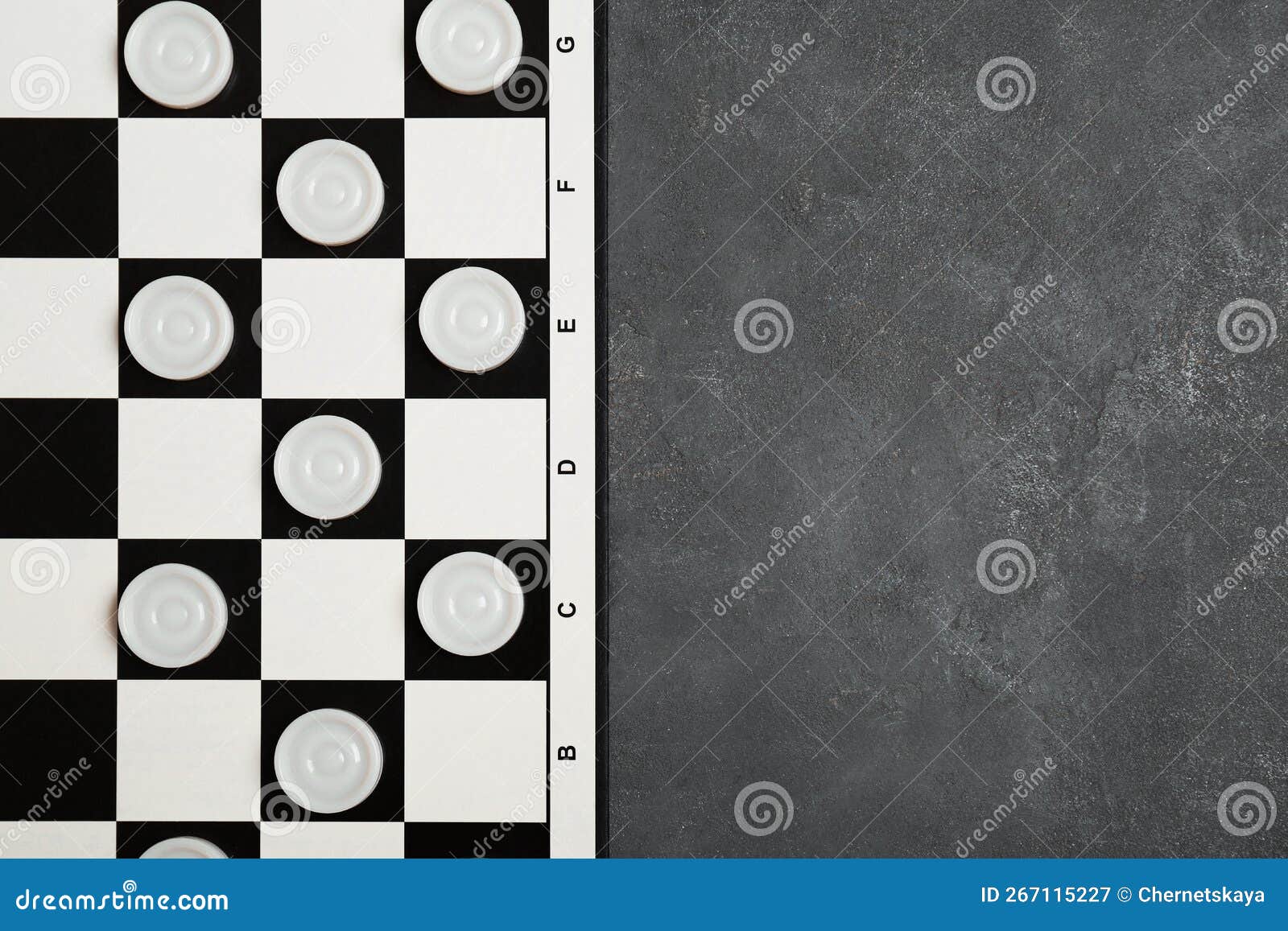 Checkerboard with Game Pieces on Grey Table, Top View. Space for Text ...