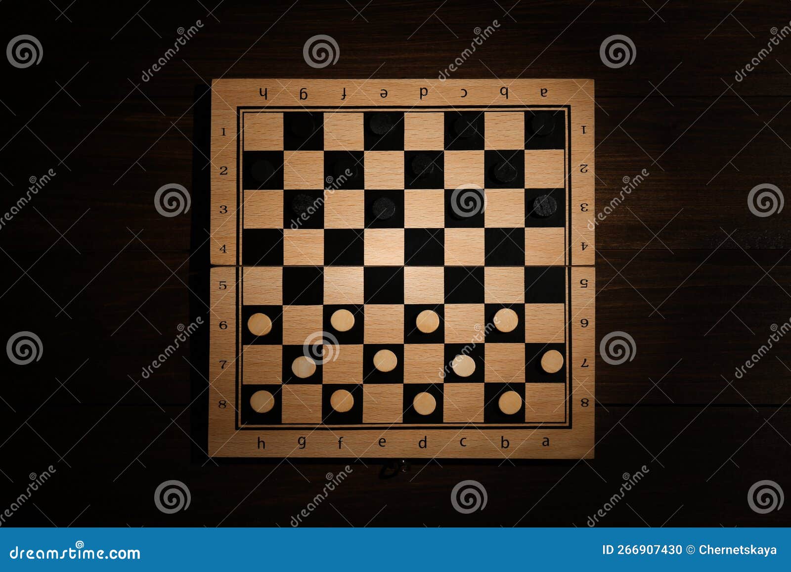 Checkerboard with Game Pieces on Wooden Table, Top View Stock Photo ...