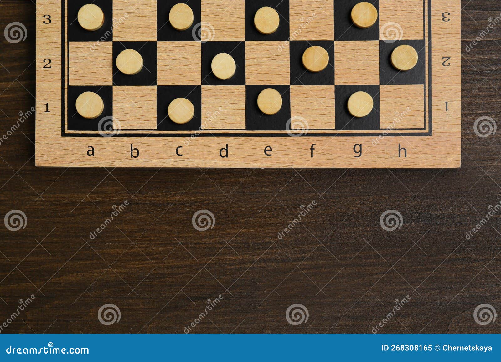 Checkerboard with Game Pieces on Wooden Table, Top View. Space for Text ...