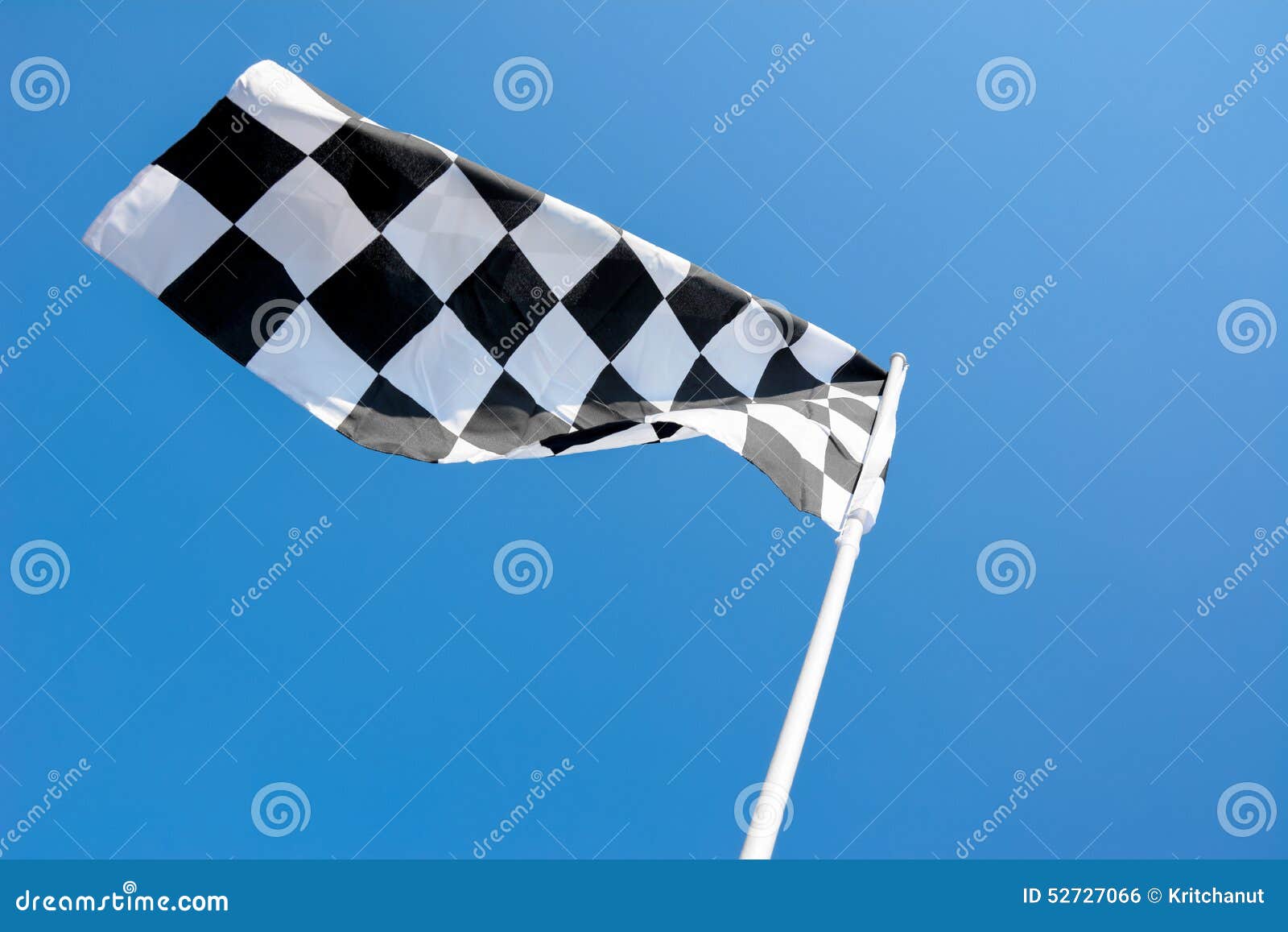 Checkered Flag Flying on Blue Sky Background Stock Photo - Image of ...