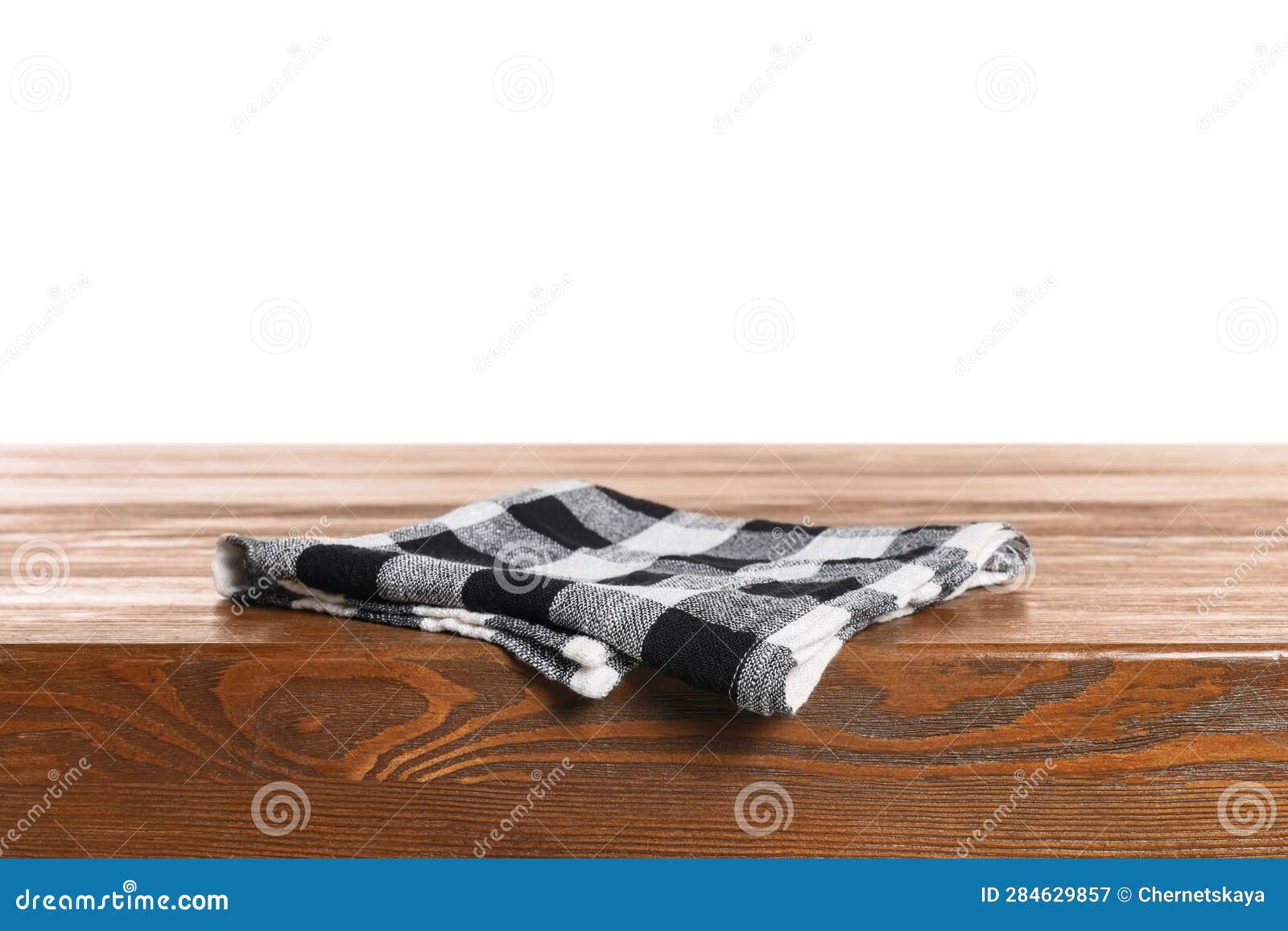 Checkered Tablecloth on Wooden Table Against White Background Stock ...