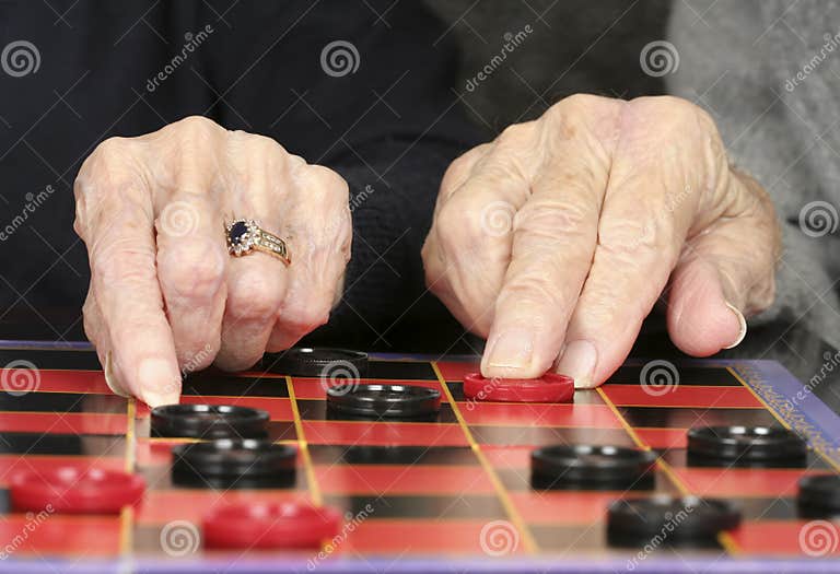 Checkers stock image. Image of hand, couple, adult, female - 13774317