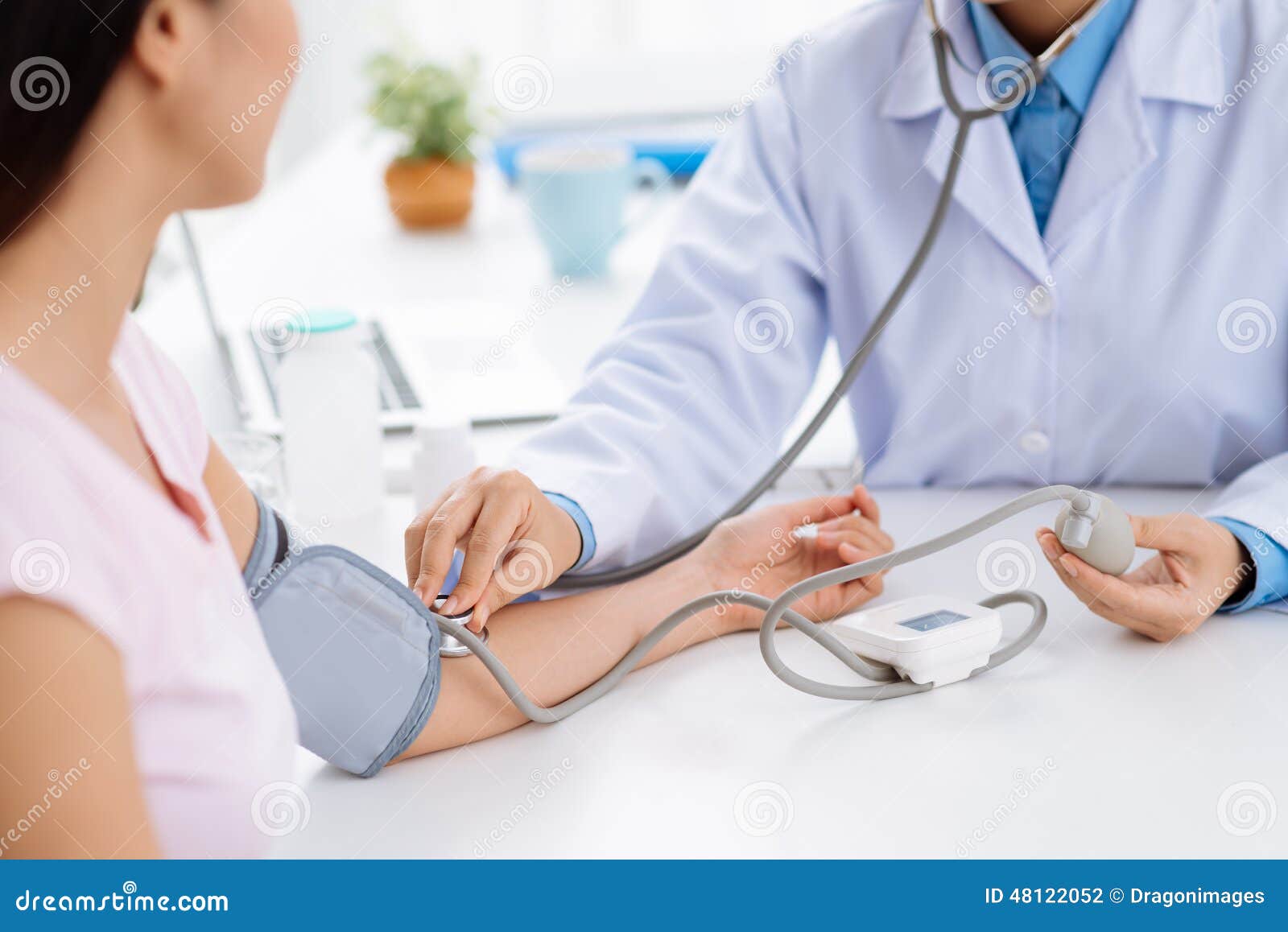 Checking blood pressure stock photo. Image of hands, focus - 48122052
