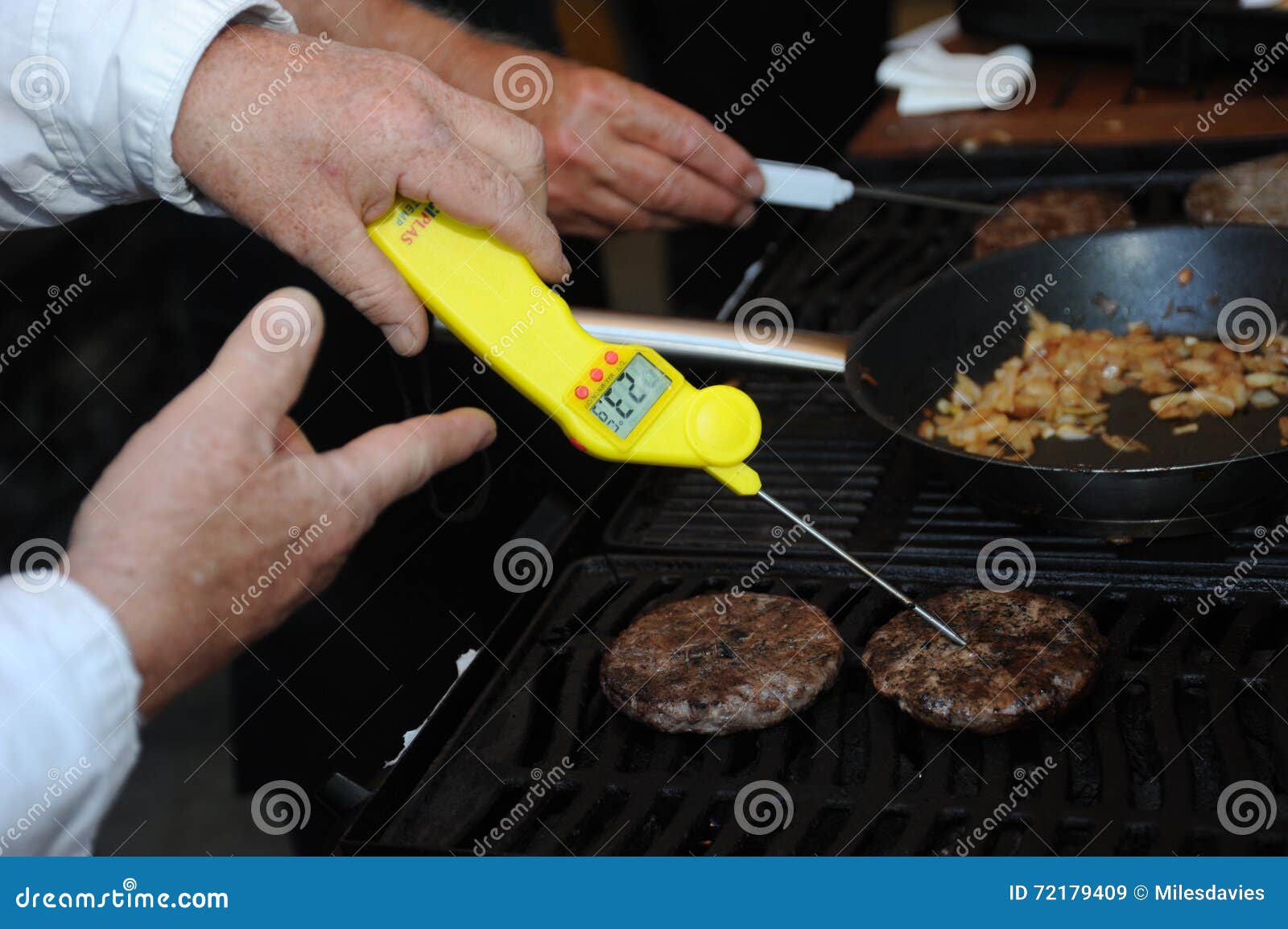 Checking Burger is cooked stock image. Image of meat - 72179409