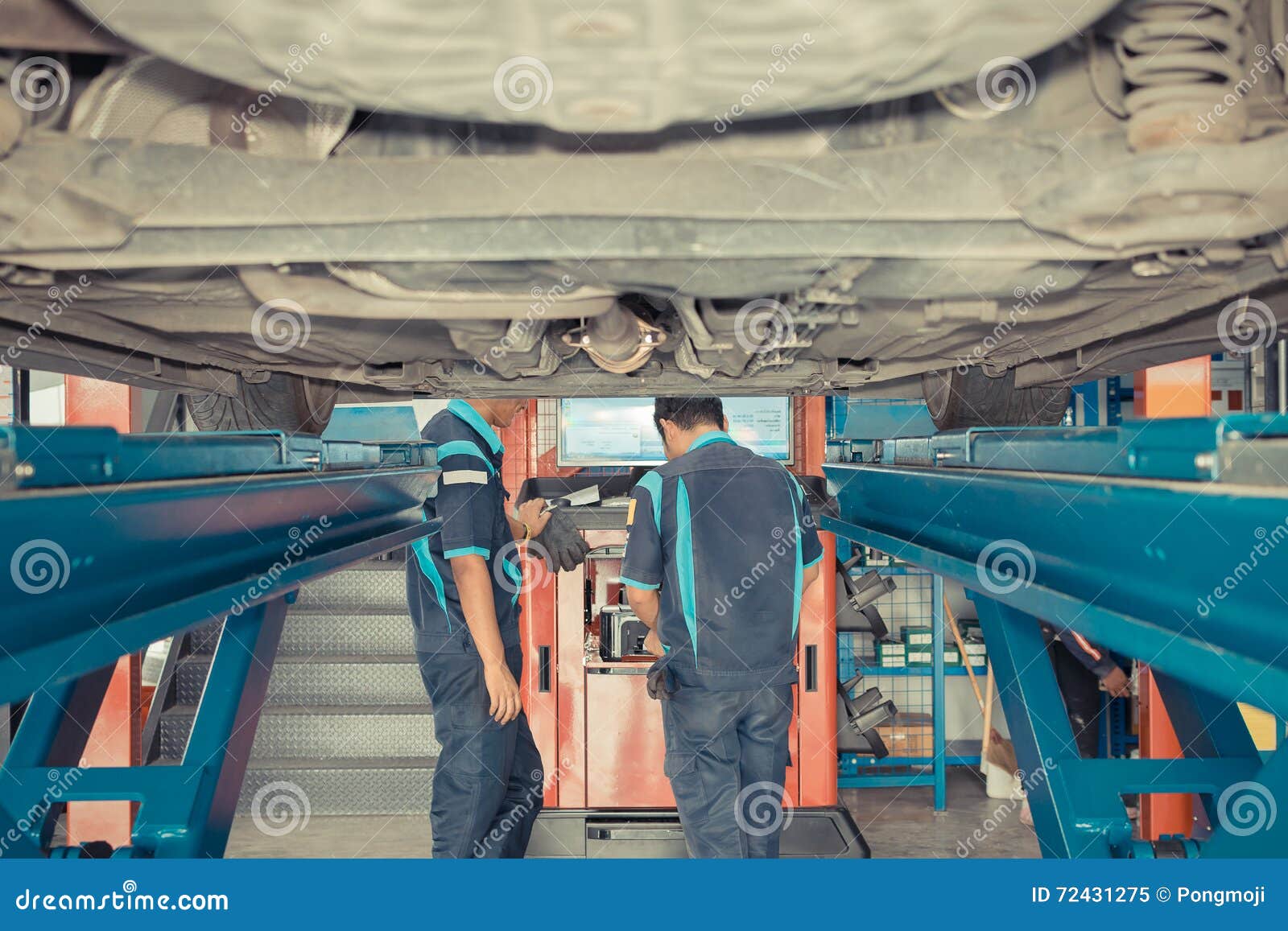Checking car suspension editorial image. Image of fixing - 72431275