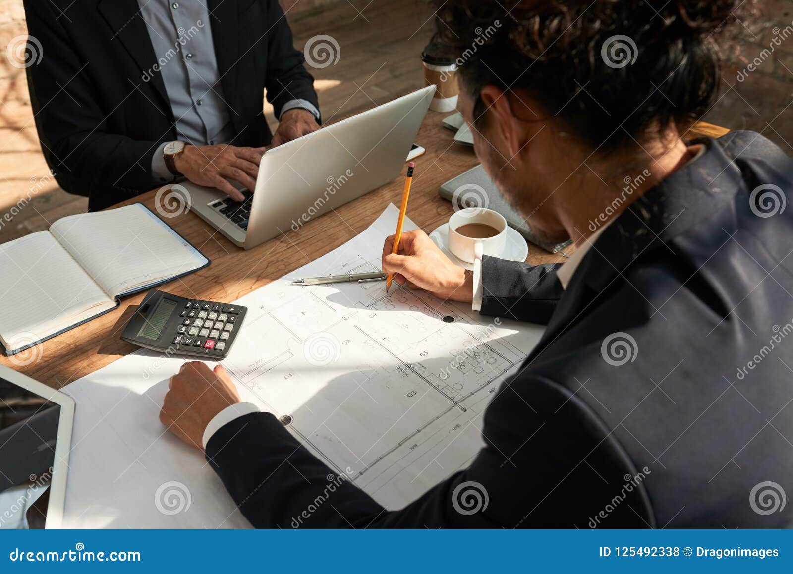 Checking construction plan stock photo. Image of teamwork - 125492338