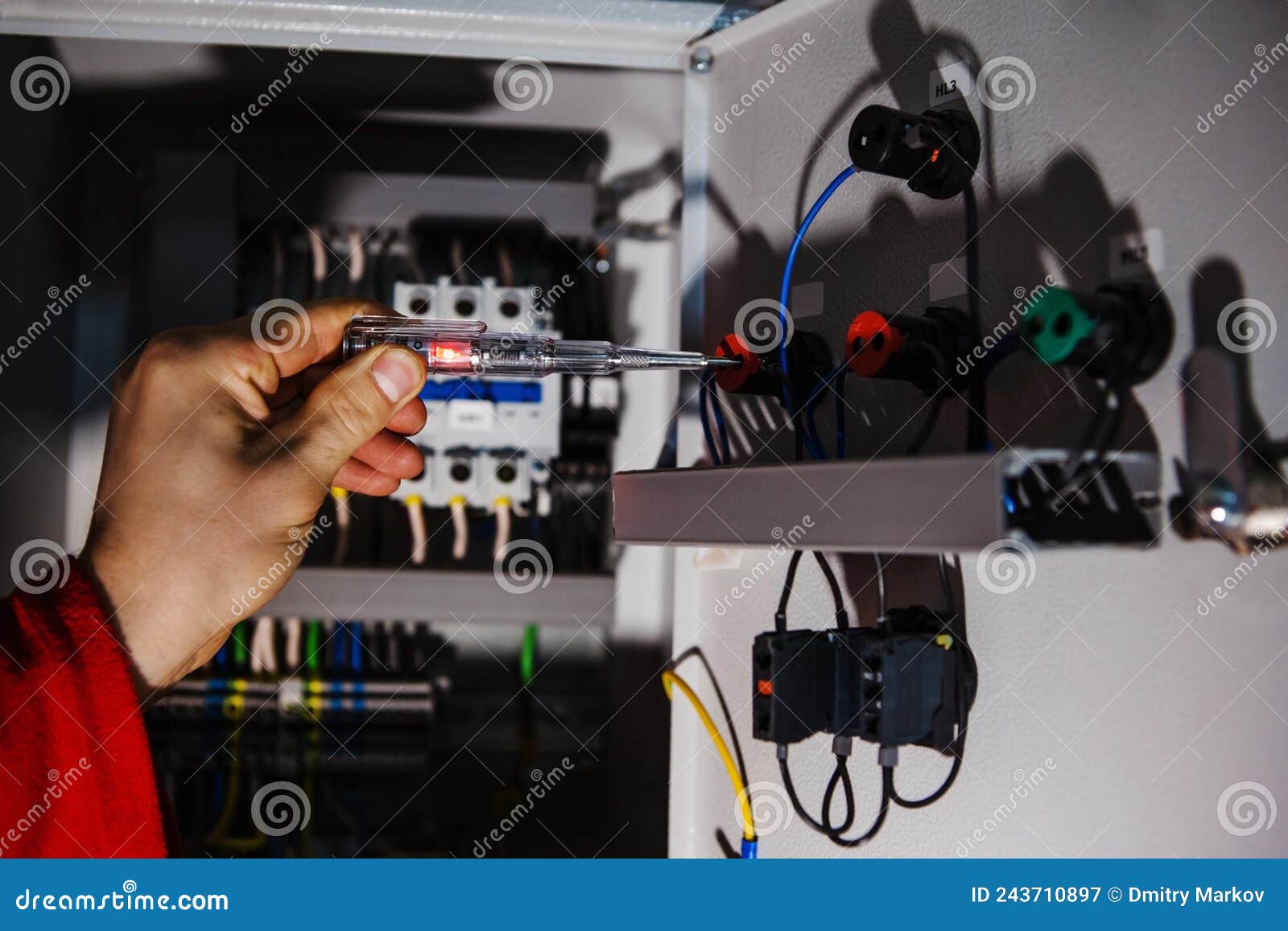 Checking the Electrical Voltage in the Junction Box. Power Measurement ...