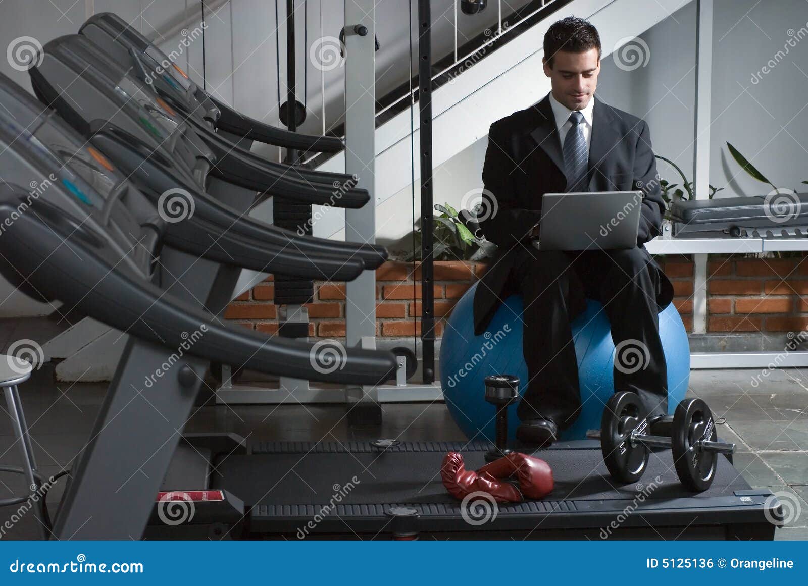 Checking Email at the Gym stock photo. Image of indoors - 5125136