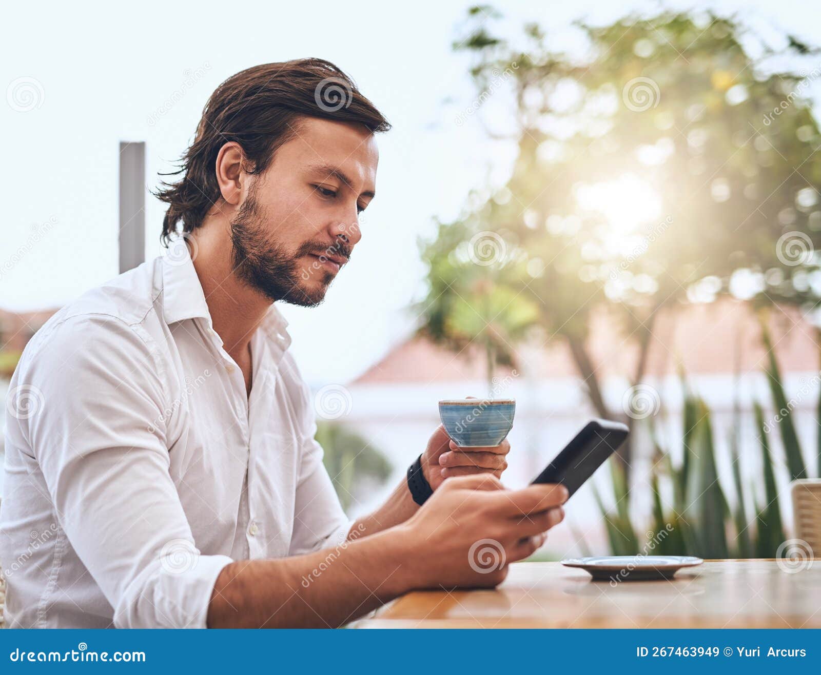 Checking the Emails while Enjoying Some Caffeine. a Young Creative ...